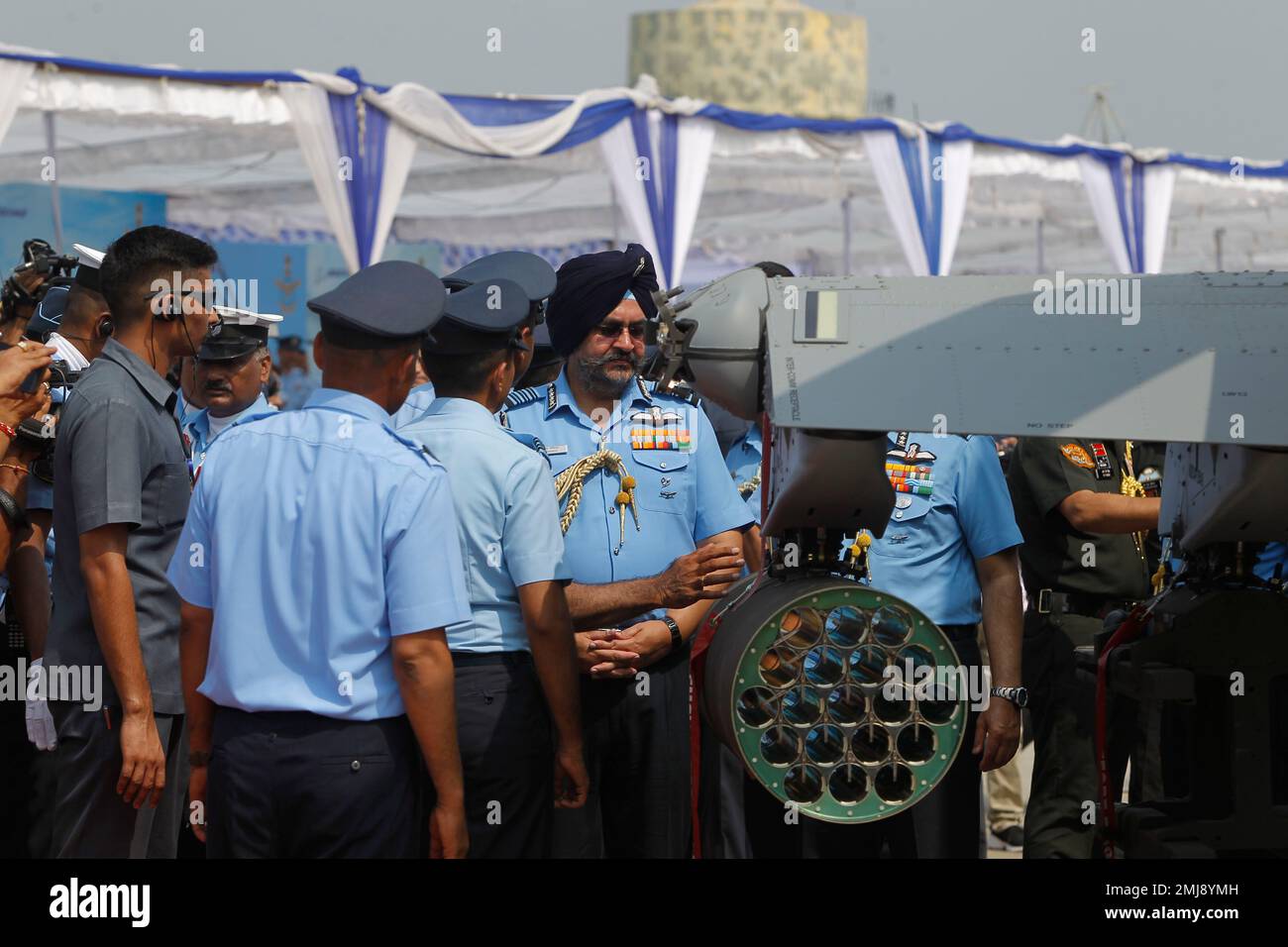 Indian Air Force Chief B S Dhanoa, center wearing turban, inspects a AH ...