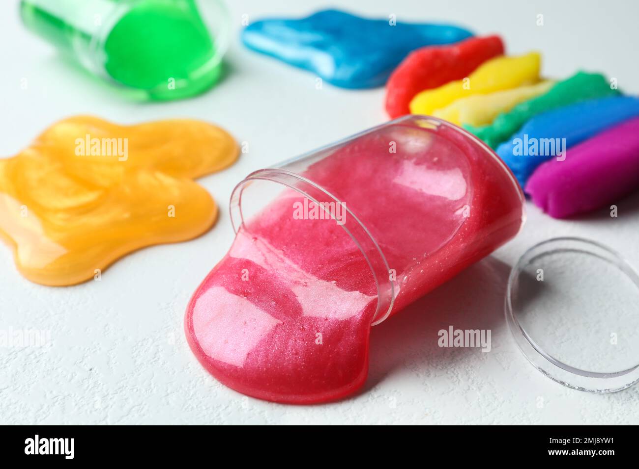 Different bright slimes on white background, closeup Stock Photo - Alamy