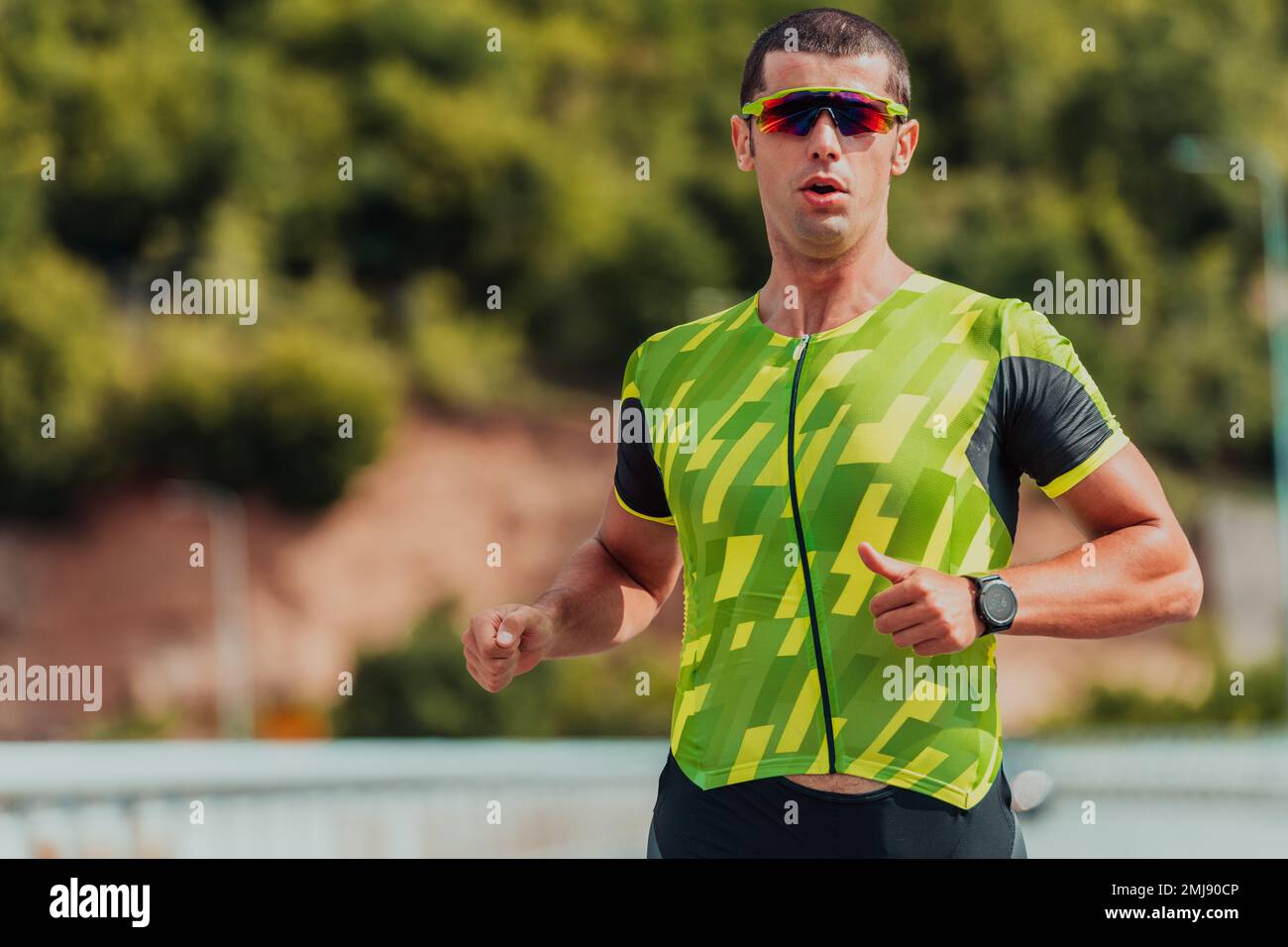An athlete running a marathon and preparing for his competition. Photo ...