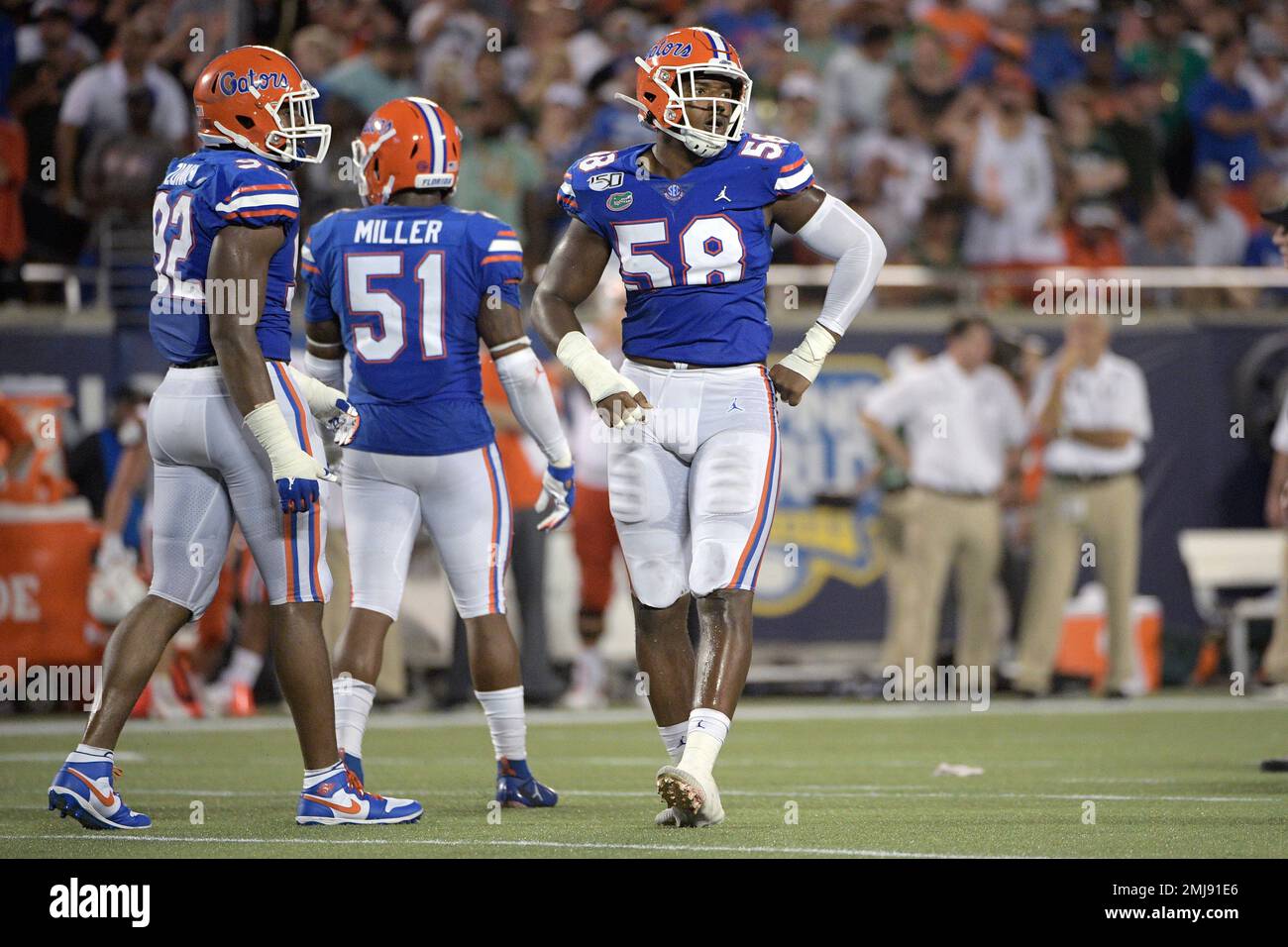 Florida defensive lineman Jabari Zuniga (92), linebacker Ventrell ...