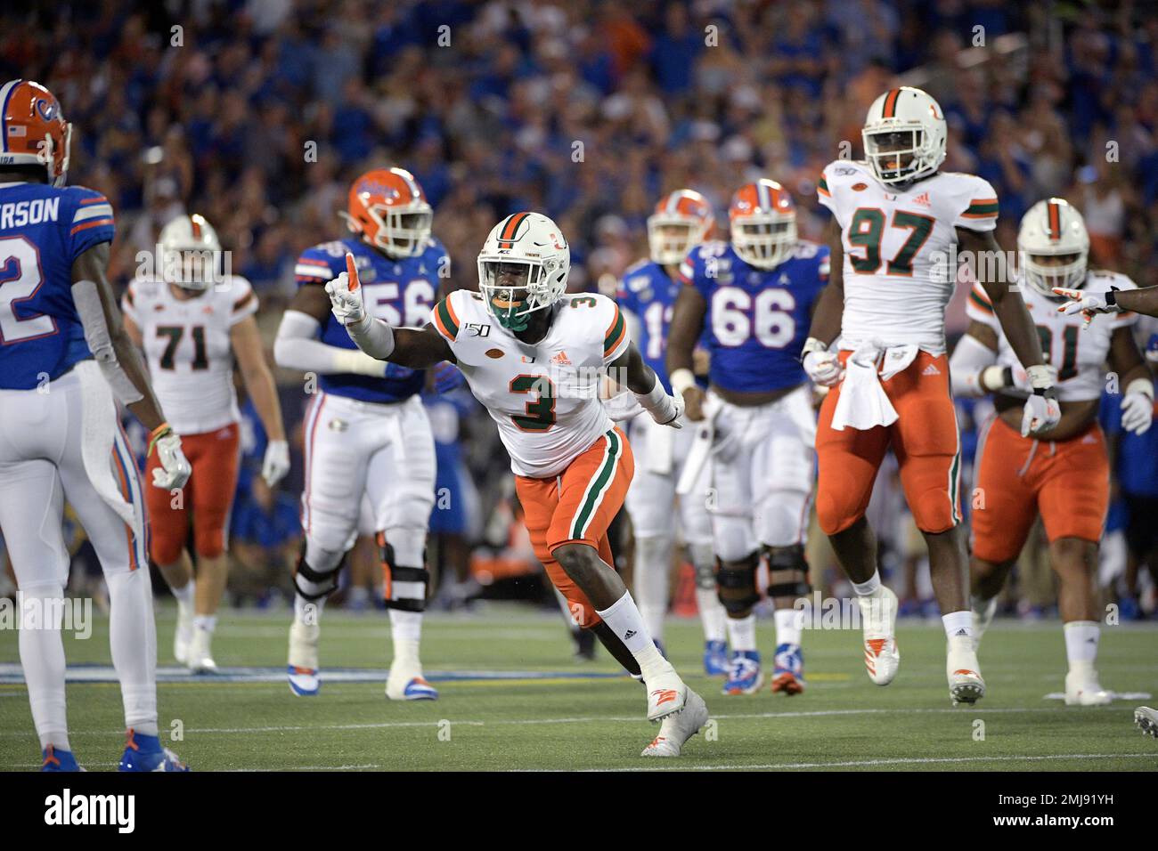 Miami linebacker Gilbert Frierson (3) celebrates with defensive lineman ...