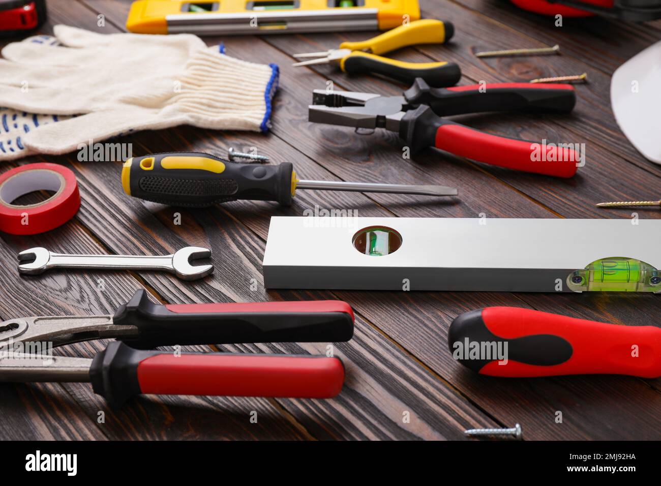 Different modern construction tools on wooden background Stock Photo ...