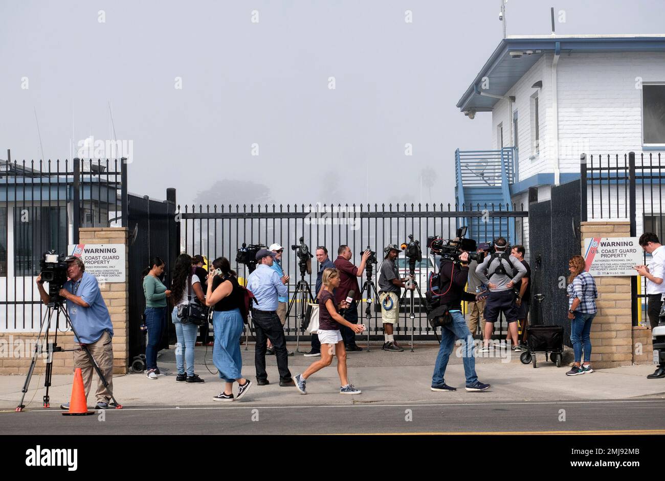 Members of media wait at outside of the U.S. Coast Guard Station ...