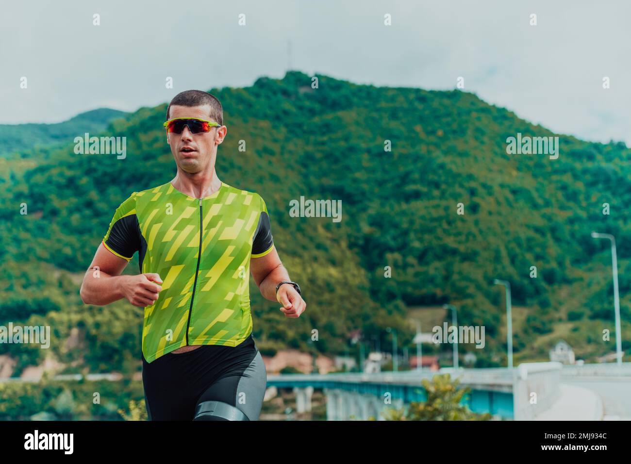 An athlete running a marathon and preparing for his competition. Photo ...