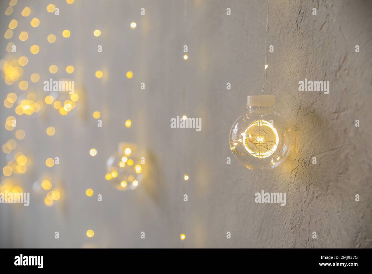 Stylish light bulb near textured white wall, space for text. Ideas for ...