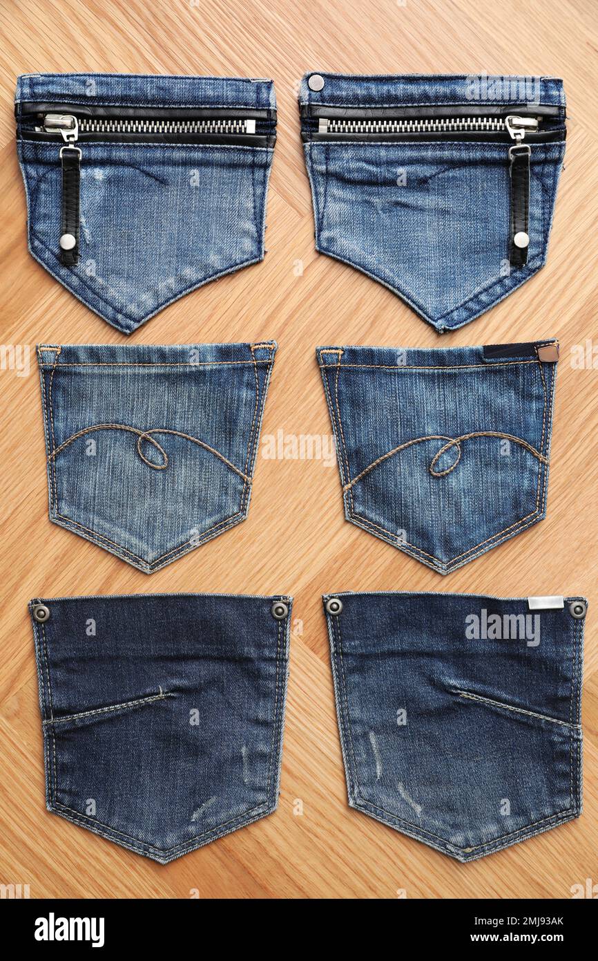 Flat lay composition with jeans pockets on table Stock Photo - Alamy