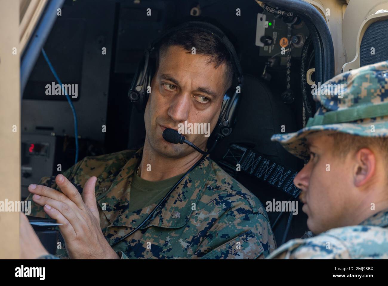 U.S. Marine Corps Maj. Timothy Keithley (left), a communications ...