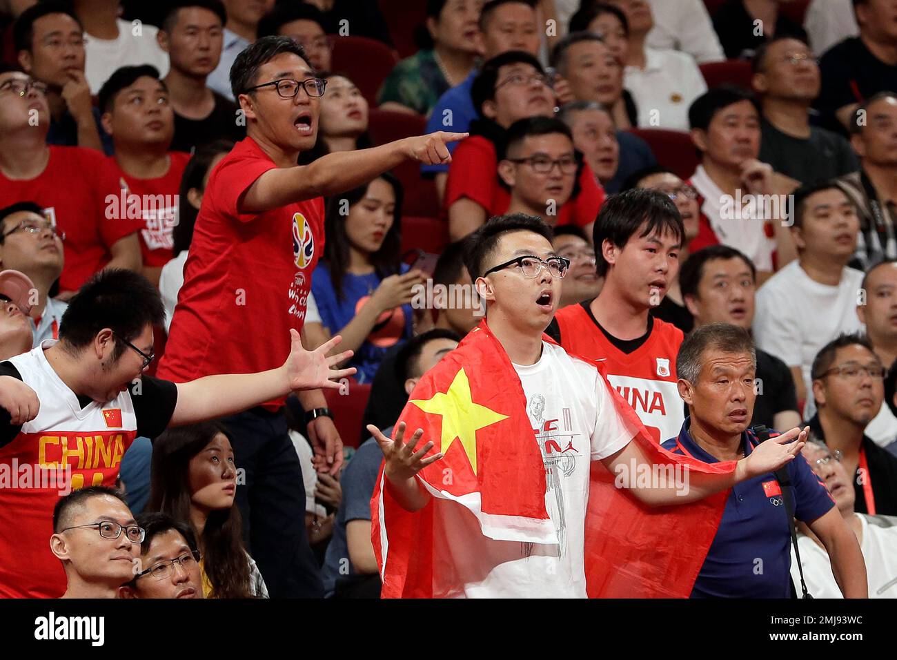 Chinese fans react during their group phase basketball game against ...