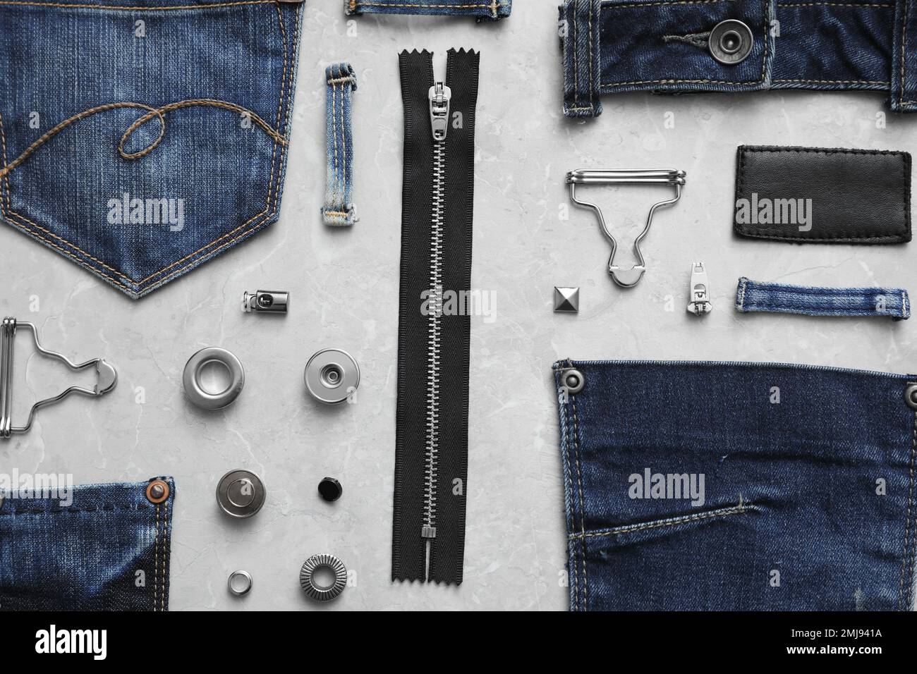 Flat lay composition with garment accessories and cutting details for ...