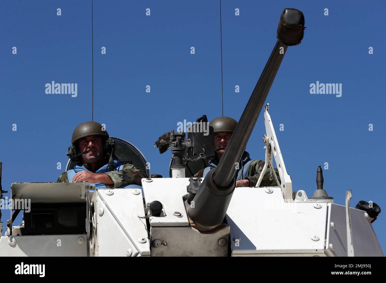 Irish UN peacekeepers sit on their armored personnel carrier as they ...