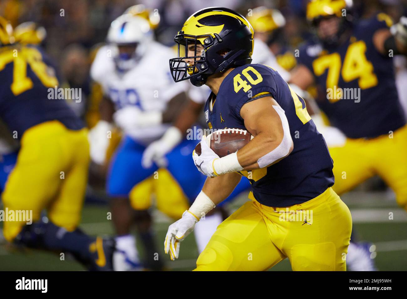 Michigan running back Ben VanSumeren (40) rushes during an NCAA ...