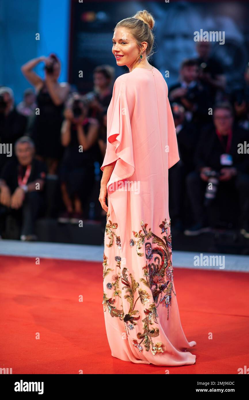 Actress Sienna Miller poses for photographers upon arrival at the ...