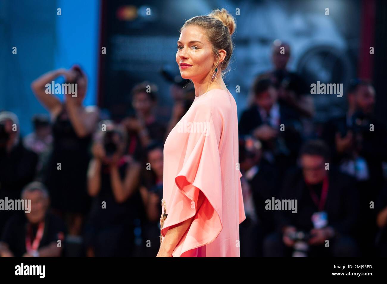 Actress Sienna Miller poses for photographers upon arrival at the ...