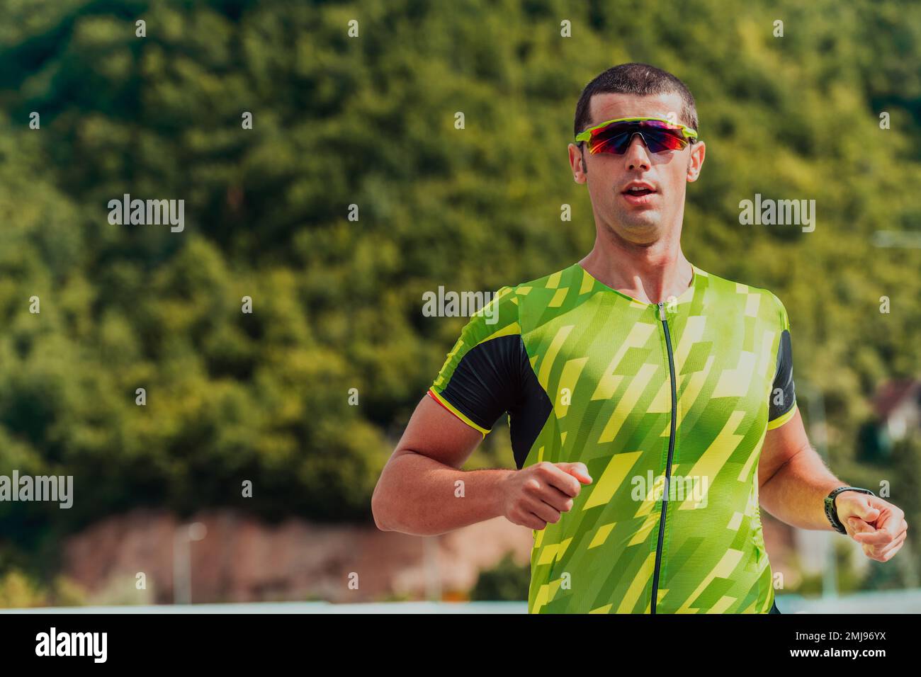 An athlete running a marathon and preparing for his competition. Photo ...