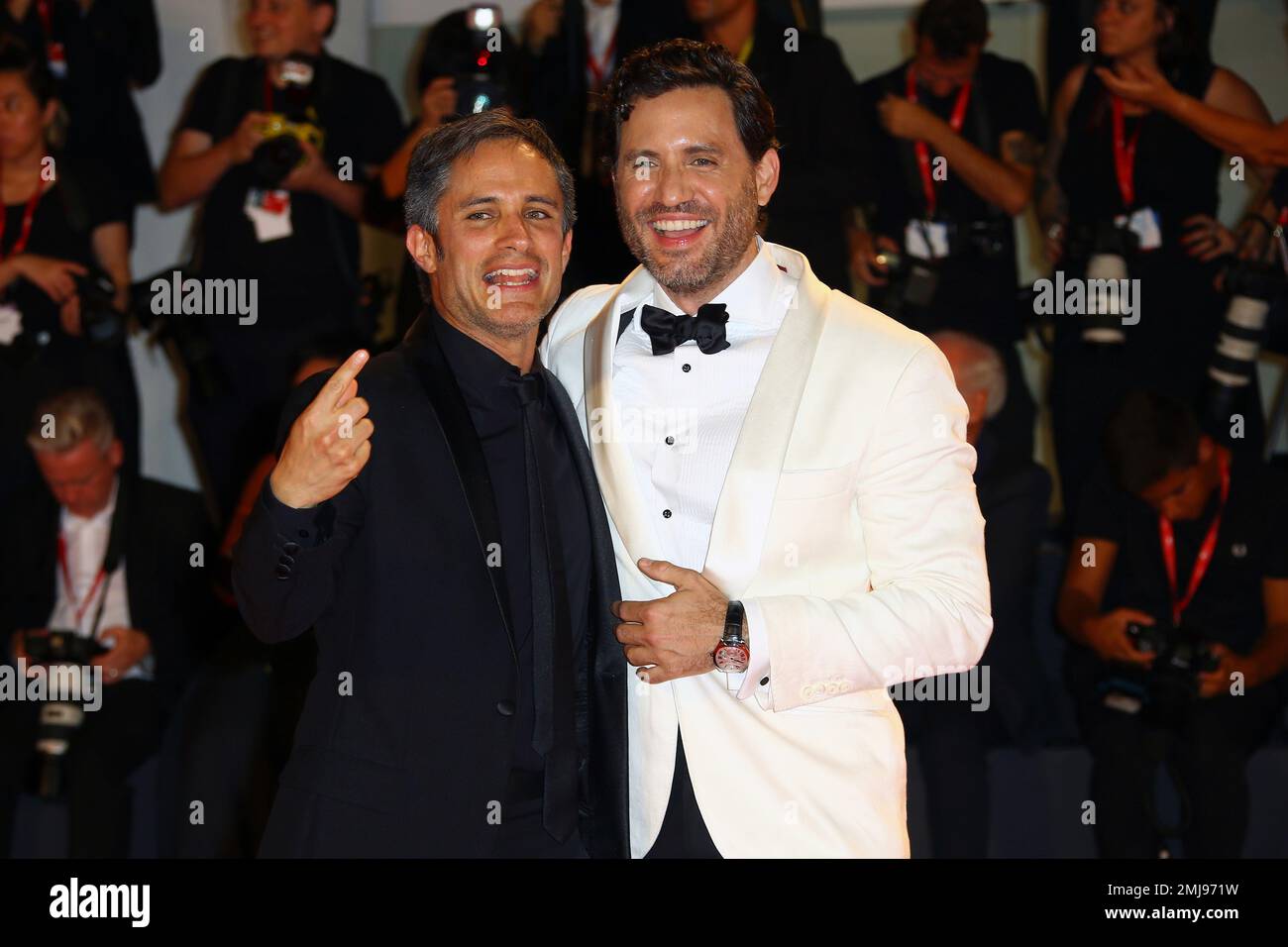 Gael Garcia Bernal, left and Edgar Ramirez pose for photographers upon ...