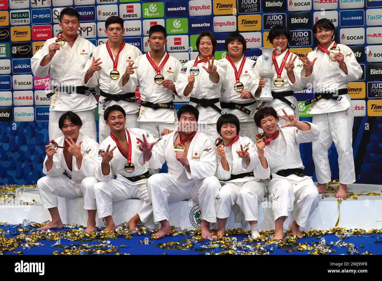 Team of Japan pose for photographers during the award ceremony of the ...
