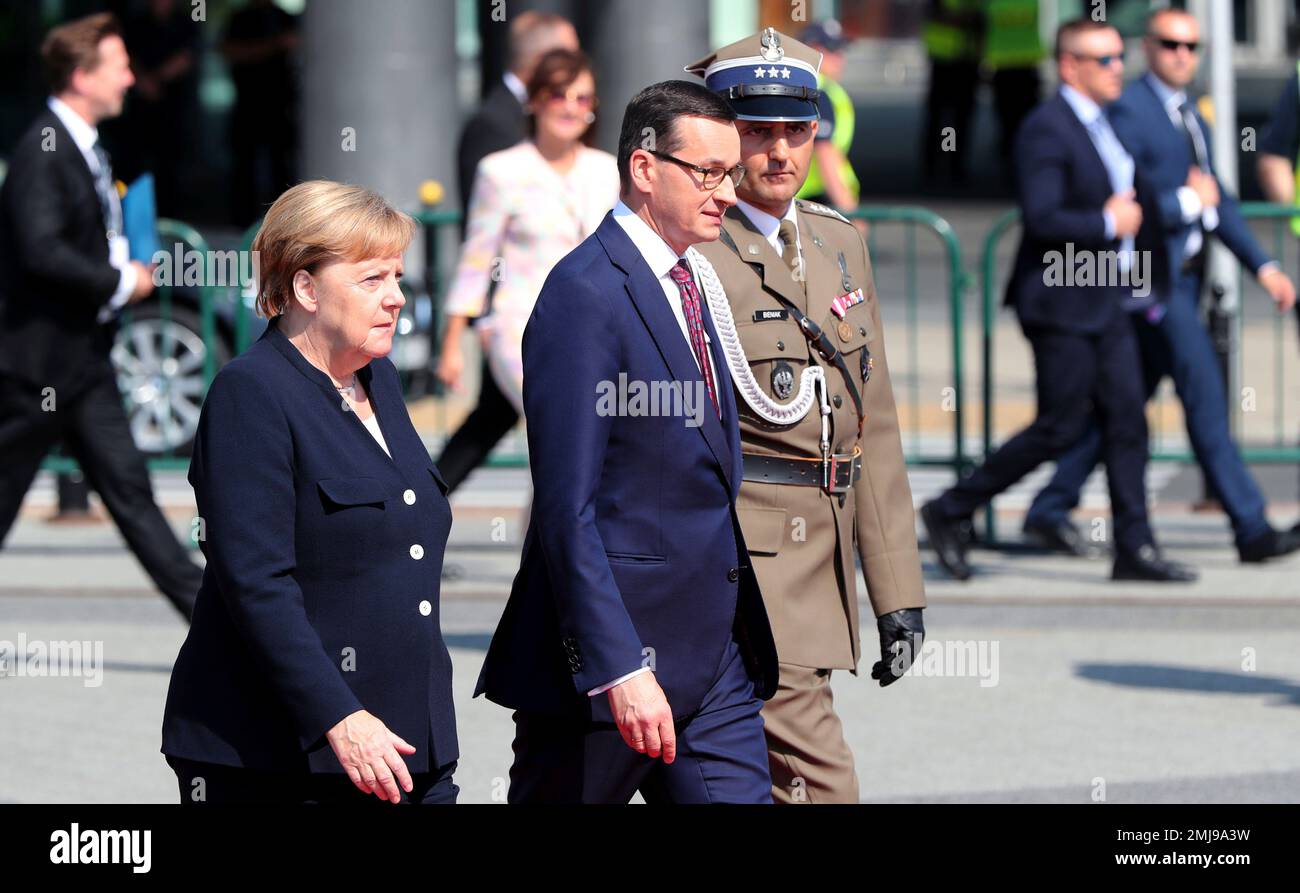 German Chancellor Angela Merkel, left, arrives with Polish Prime ...