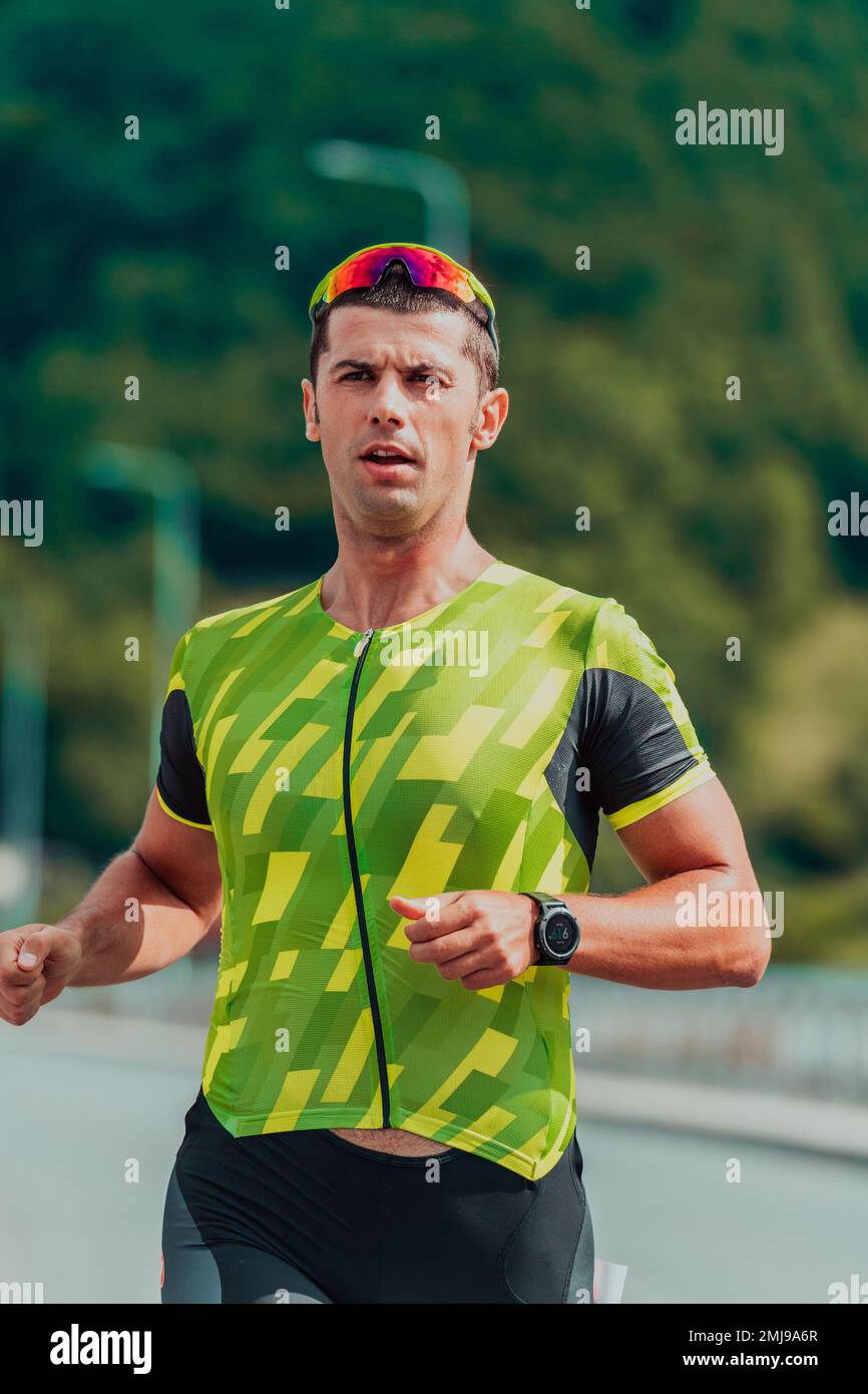 An athlete running a marathon and preparing for his competition. Photo ...