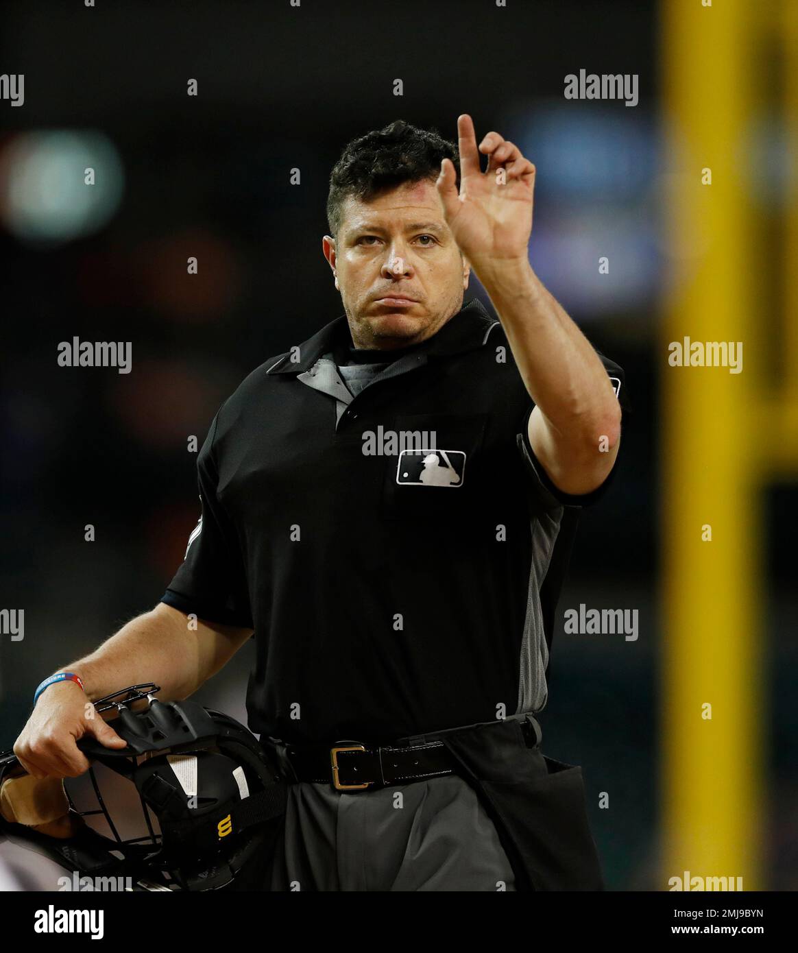 Home plate umpire Carlos Torres signals during the eighth inning of a ...