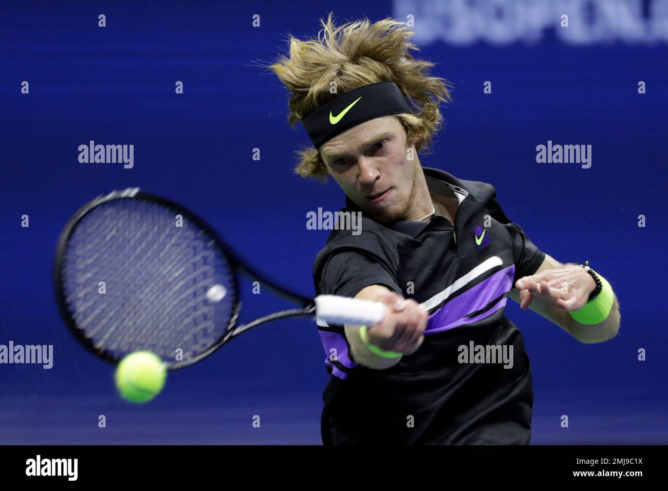 Andrey Rublev, of Russia, returns a shot to Nick Kyrgios, of Australia ...