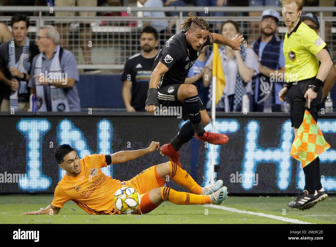 Sporting Kansas City forward Erik Hurtado leaps over Houston Dynamo ...