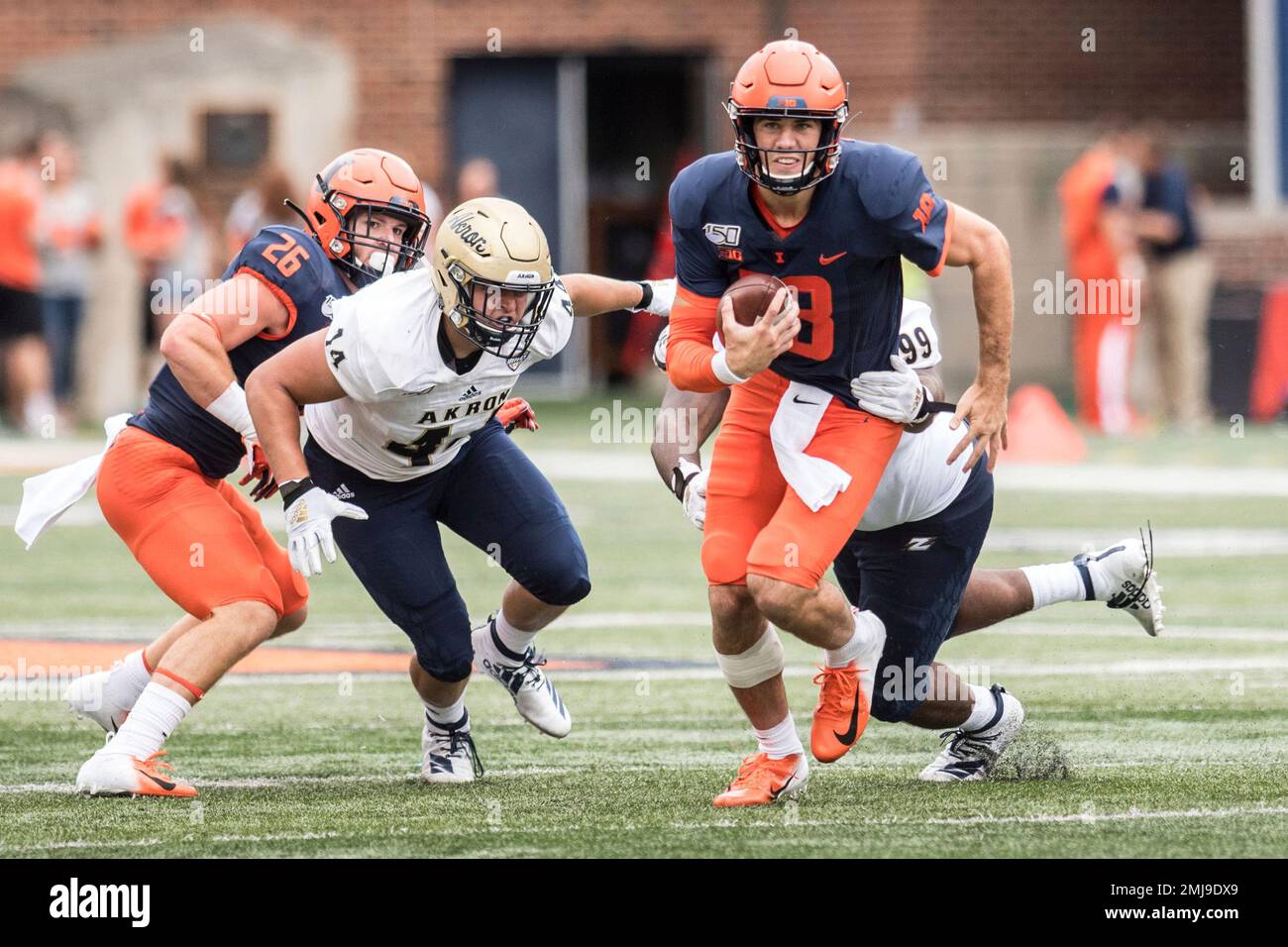 Illinois quarterback Brandon Peters (18) runs the ball in the first ...