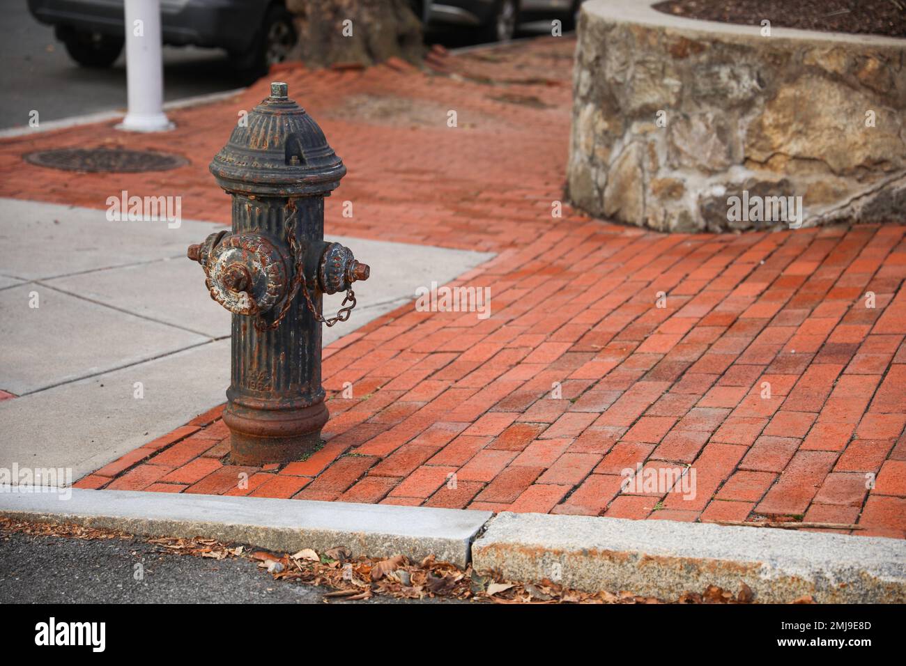 Old Fire Hydrant on the street stone cement sidewalk Stock Photo - Alamy