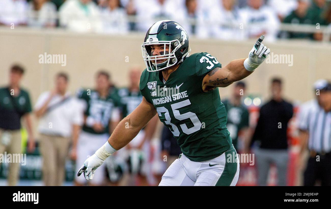 Michigan State linebacker Joe Bachie (35) gestures positions to his ...