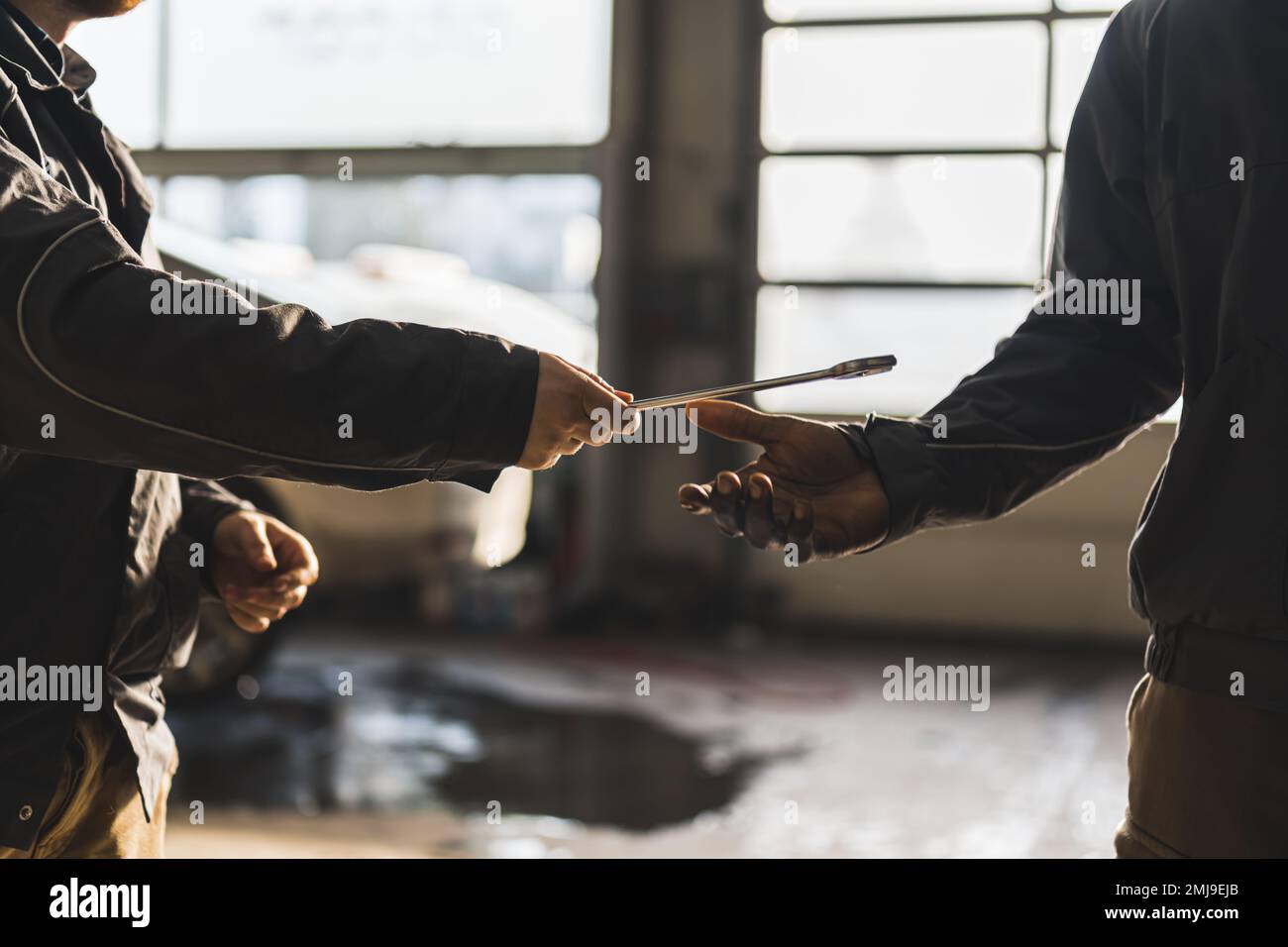 Hand mechanic holding wrench hi-res stock photography and images - Alamy