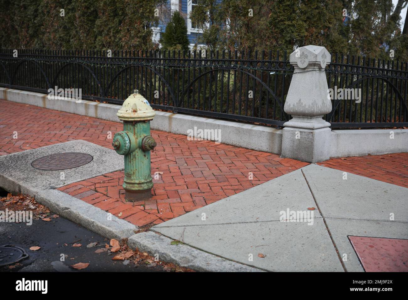 Old Fire Hydrant on the street stone cement sidewalk Stock Photo - Alamy