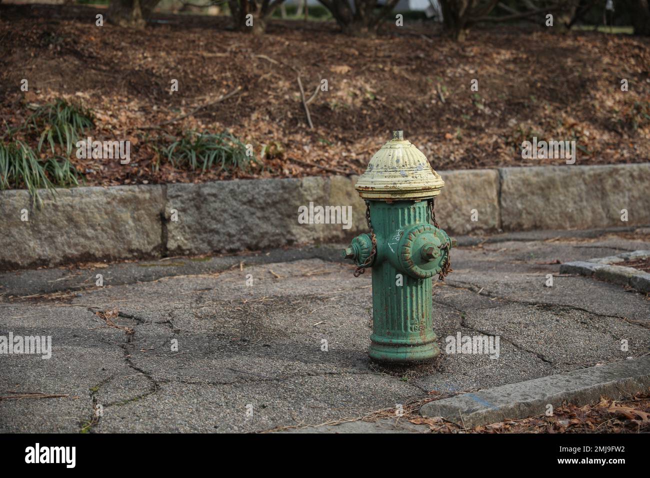 Old Fire Hydrant on the street stone cement sidewalk Stock Photo - Alamy