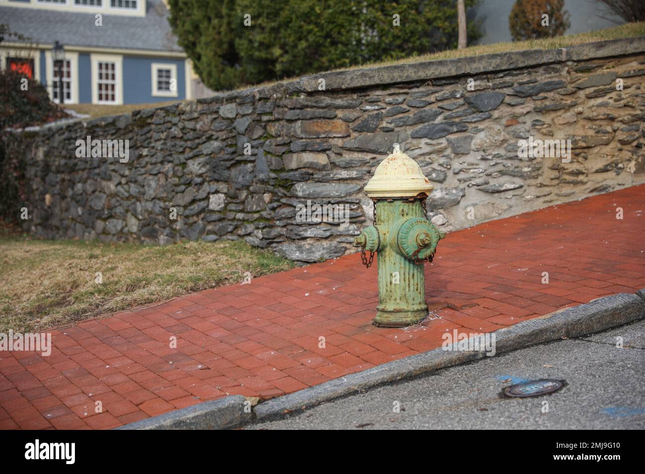 Old Fire Hydrant on the street stone cement sidewalk Stock Photo - Alamy