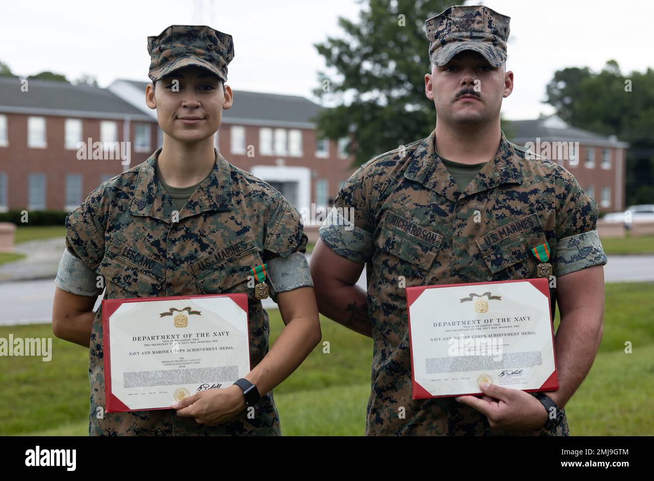U.S. Marine Corps Sgt. Michelle Lescano, left, and Lance Cpl. Colton ...