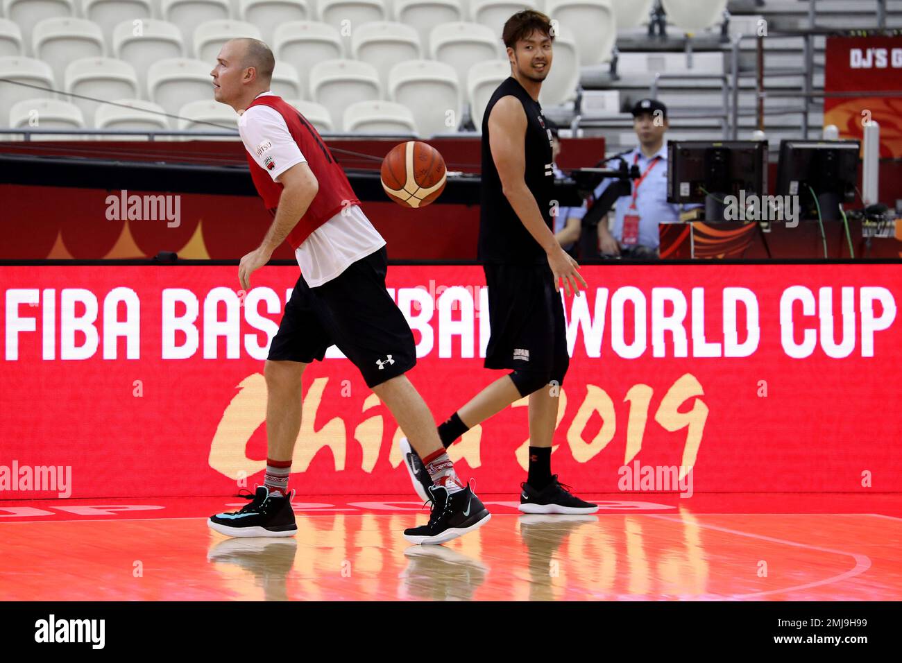 Japan's Nick Fazekas, left and Kosuke Takeuchi past by each other ...