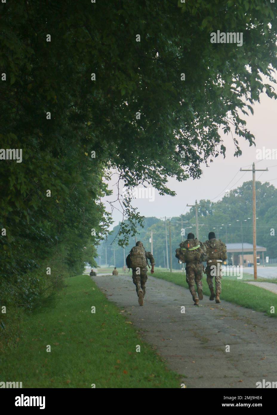 Fort Campbell Soldiers cross the finish line of the 12-kilometer (7.46 ...