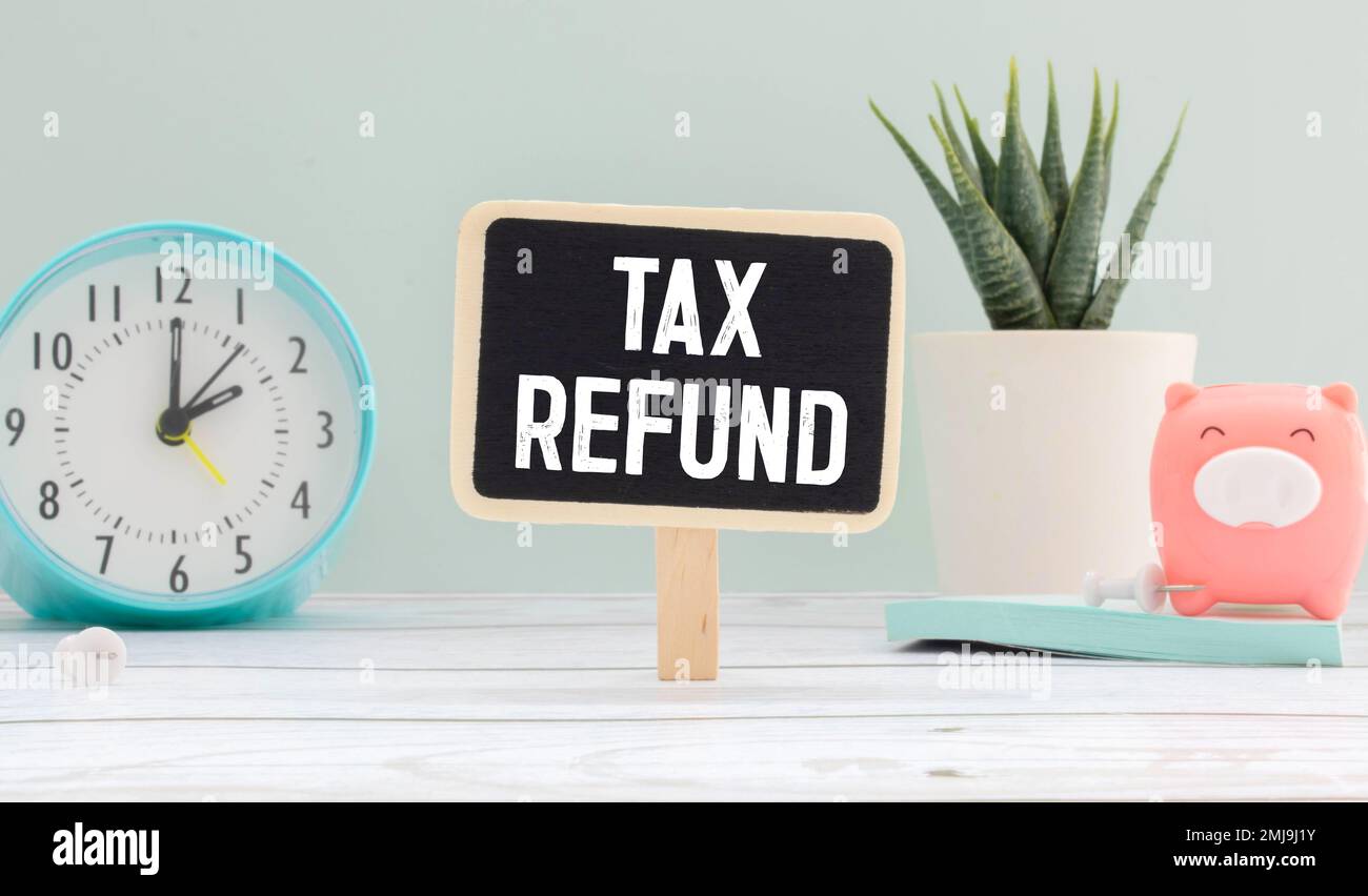 Notebook with a Business notes TAX REFUND on the office table with ...