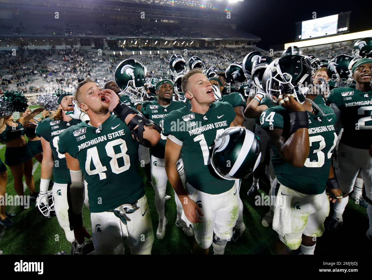 Michigan State players, including Kenny Willekes (48), Brian Lewerke ...