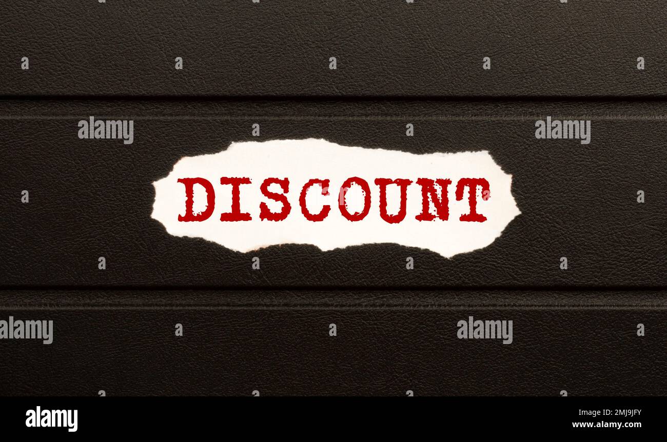 Wooden cubes with the word DISCOUNT stand on a wooden background ...