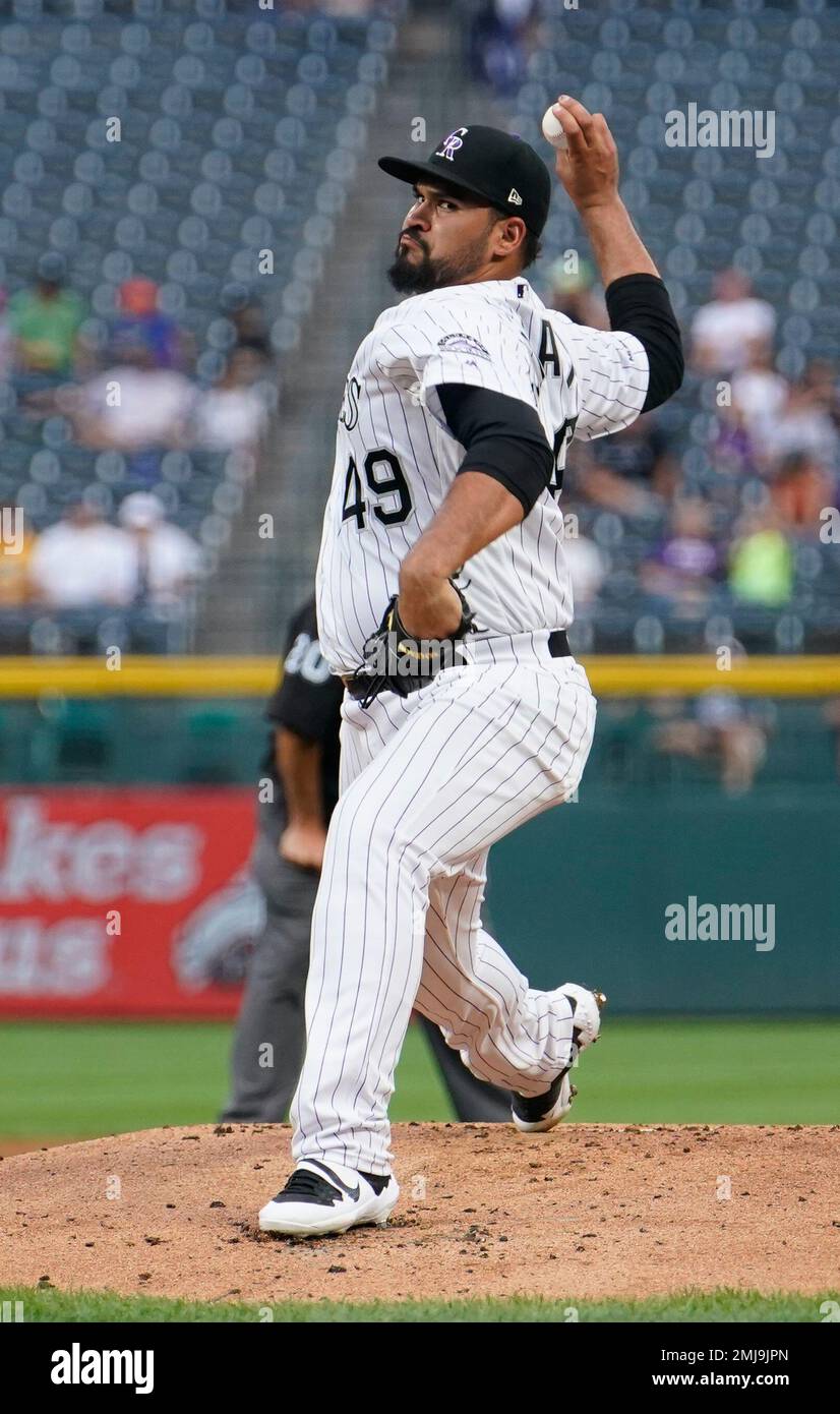 Colorado Rockies right fielder Sam Hilliard throws to the plate against ...