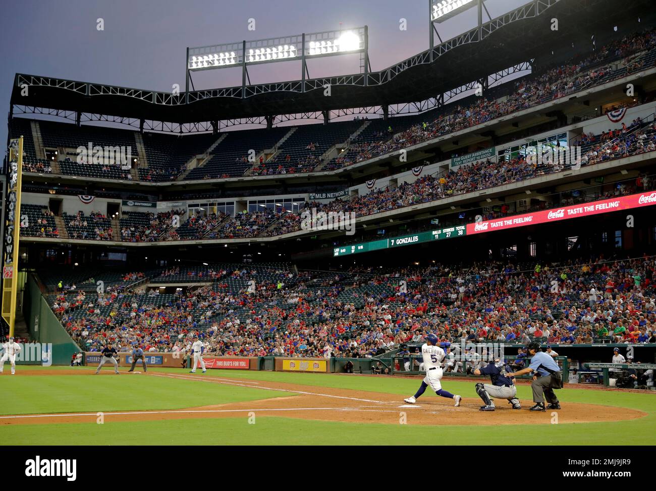 Texas Rangers designated hitter Willie Calhoun (5) follows through on ...