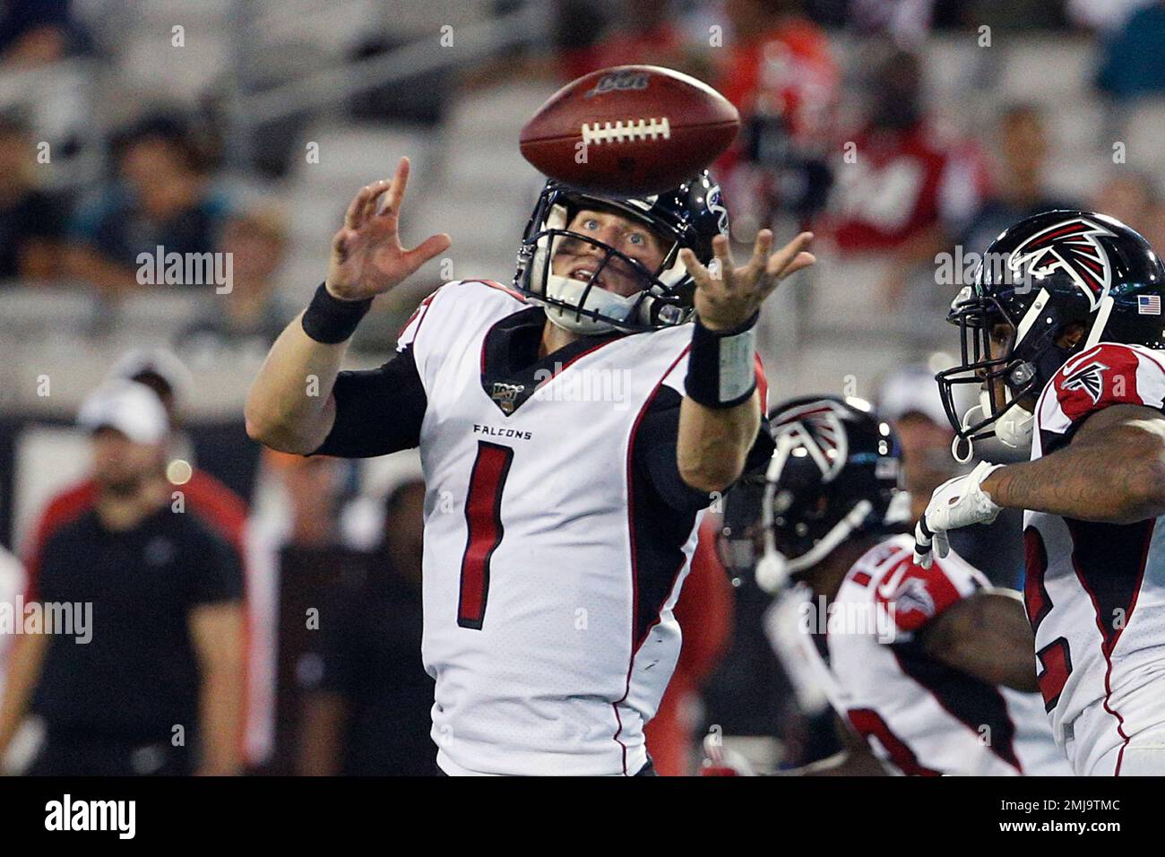 Atlanta Falcons quarterback Danny Etling (1) tries to get the handle on ...