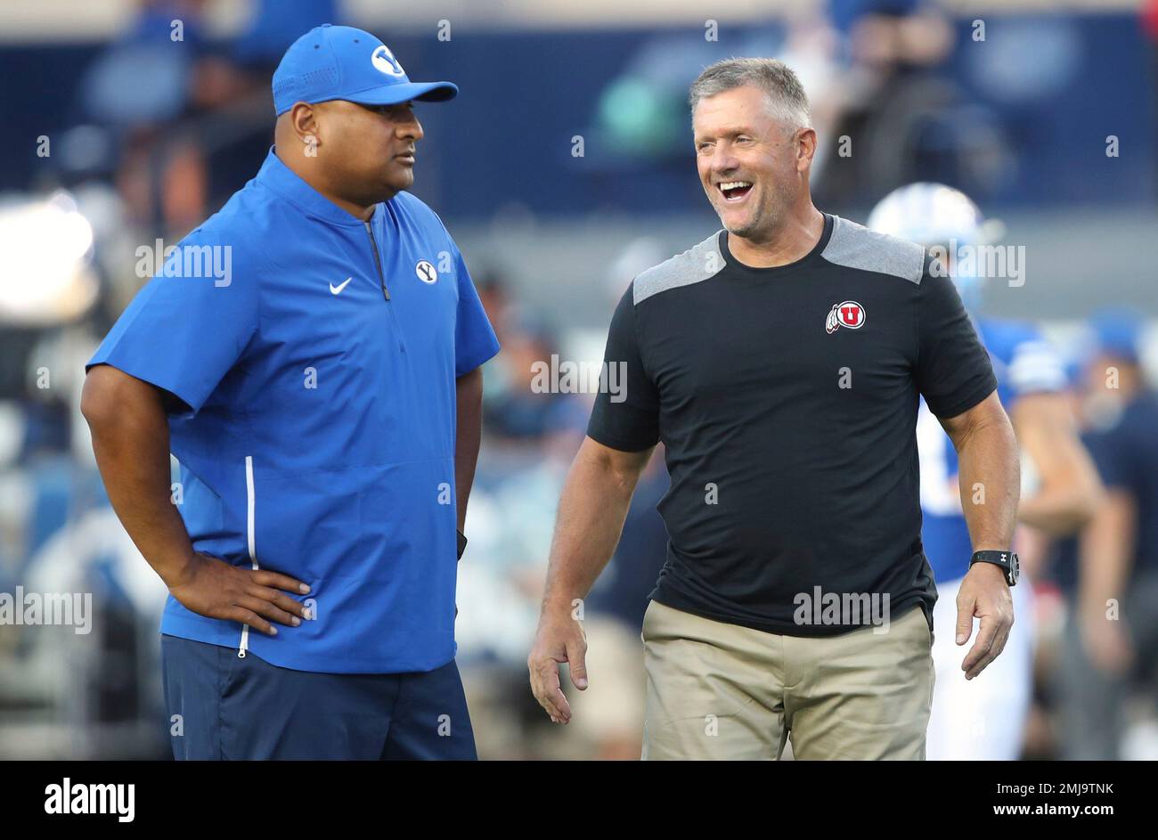 BYU coach Kalani Sitake, left. and Utah coach Kyle Whittingham, right ...