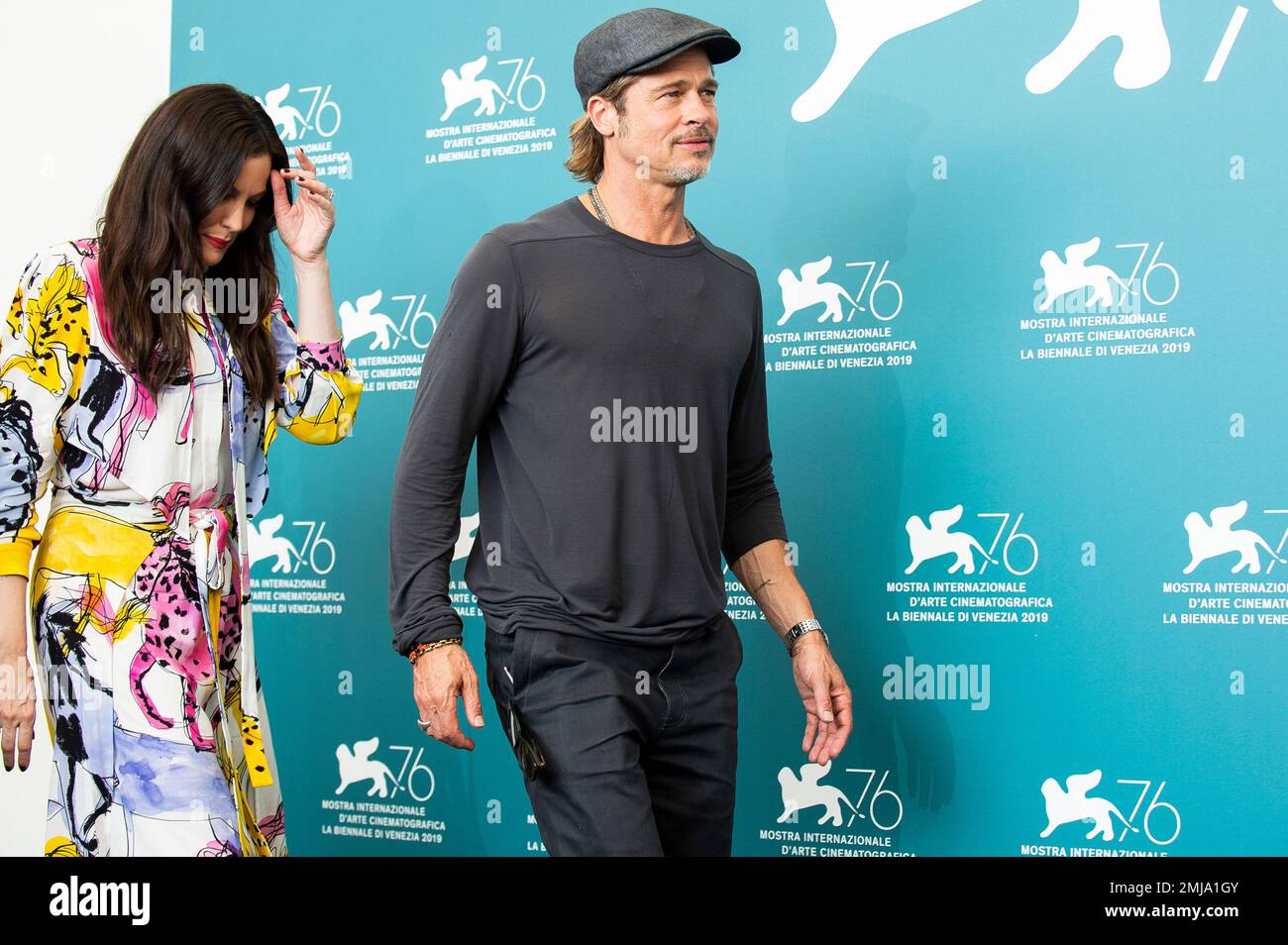 Actors Liv Tyler, left, and Brad Pitt pose for photographers at the ...