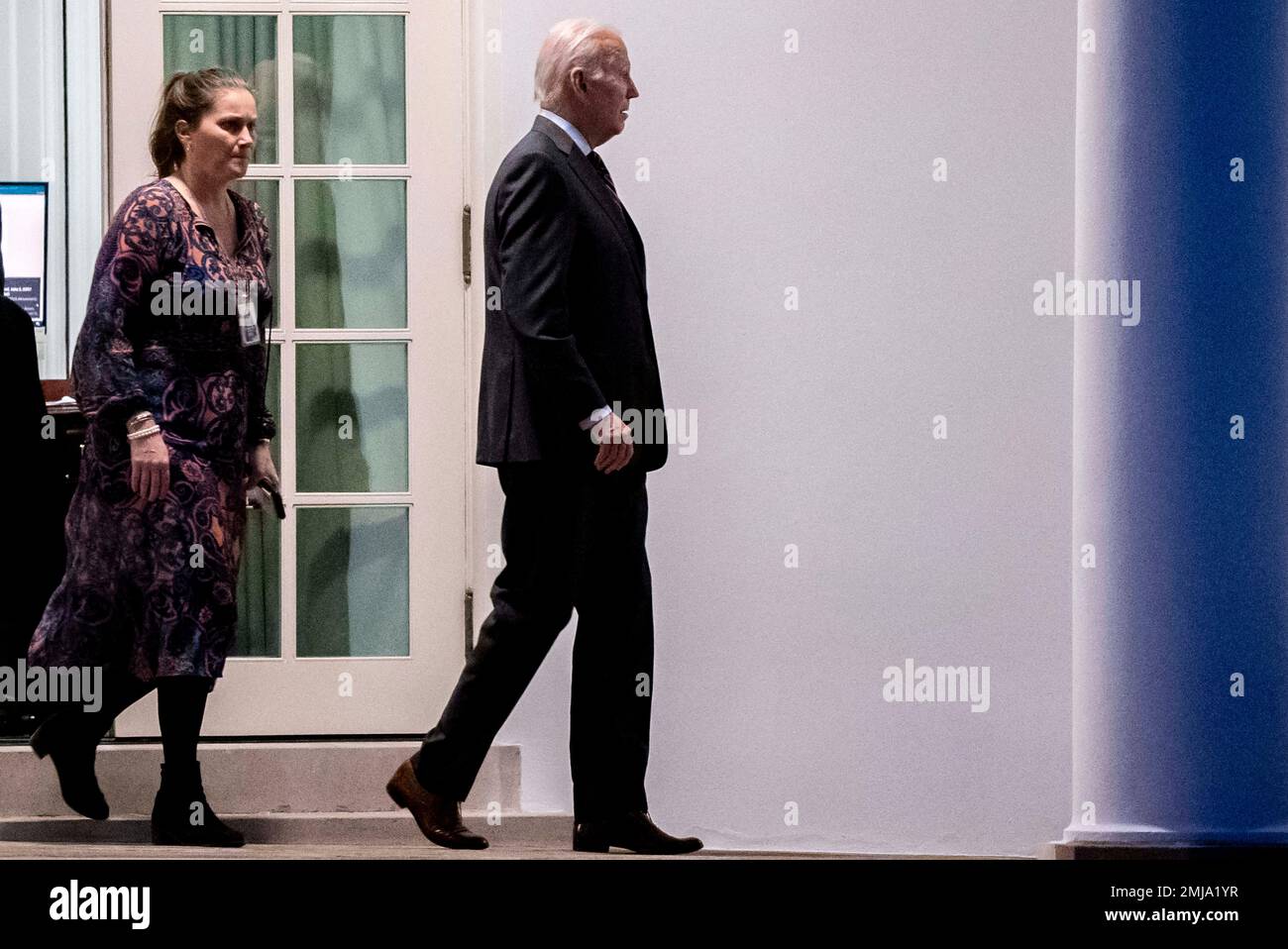 U.S. President Joe Biden walks with Assistant to the President and ...