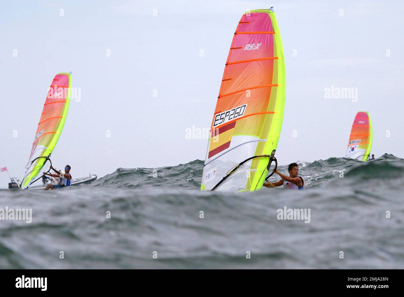 Spain's Angel Granda-Roque, front, competes in the RS:X class during ...