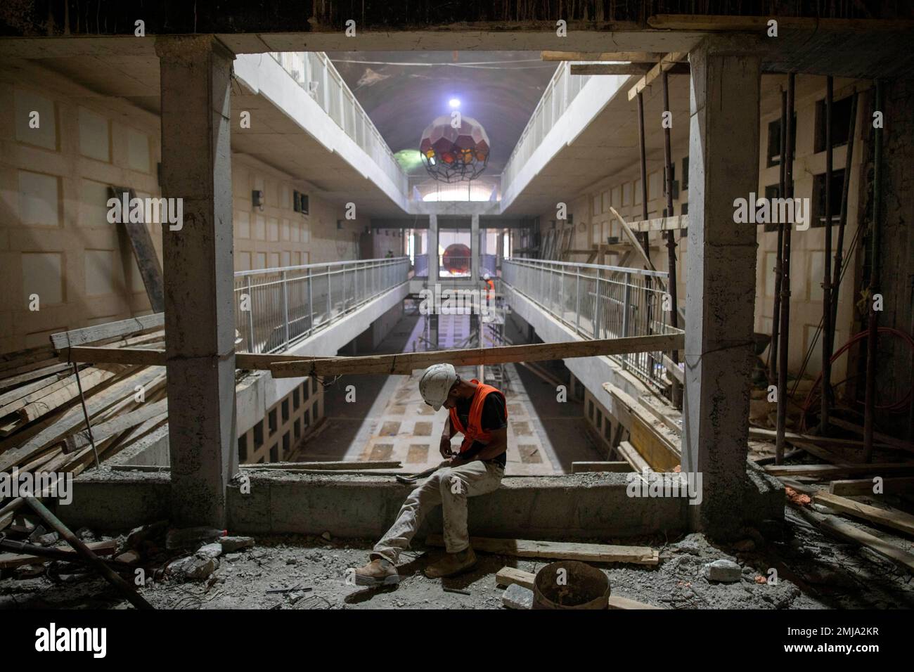 In this Sunday, Aug. 18, 2019 photo, a laborer works at the ...