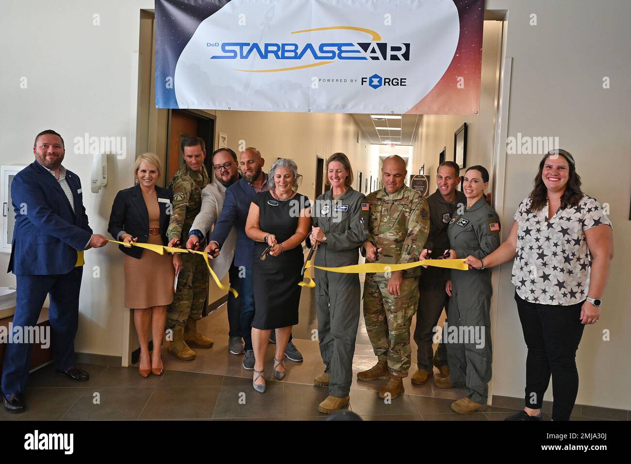 Colonel Angela Ochoa, 19th Airlift Wing and installation commander, cut ...