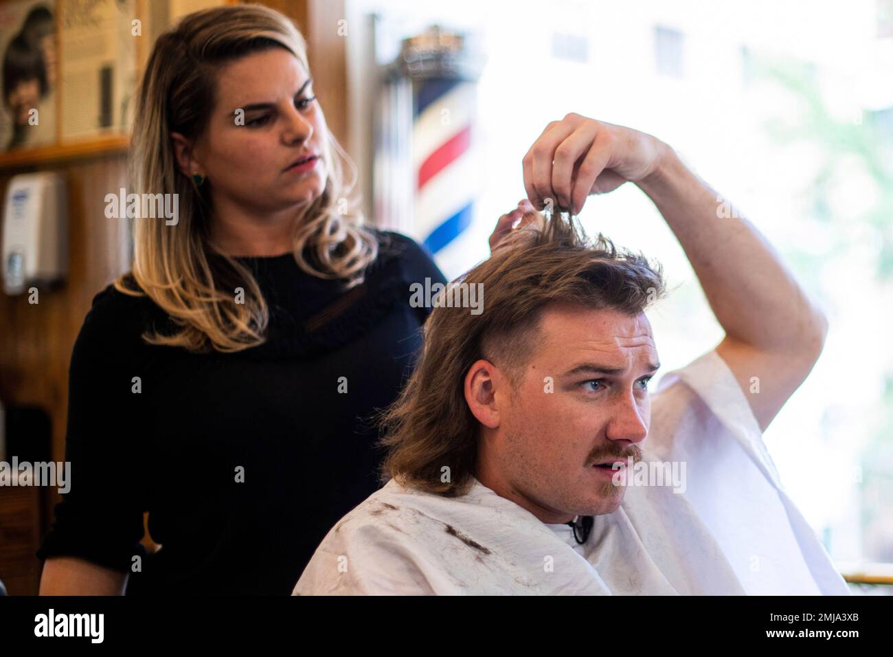 Country singer Morgan Wallen receives a mullet at Paul Mole Barber Shop ...