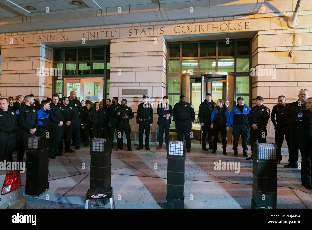 U.S. Capitol police officers stand outside the federal courthouse in ...
