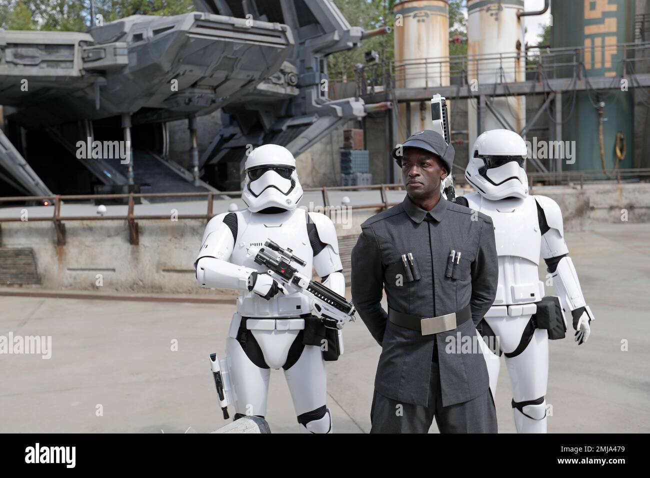 A First Order officer, center, and two storm troopers on patrol during ...